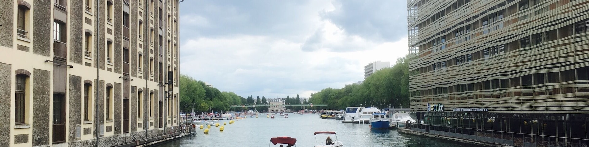La Villette
Bassin 
Fun in Paris in summer
Great place for boating on the canal 
Modern and trendy place 
Take your beers and enjoy the canal and the chairs along
