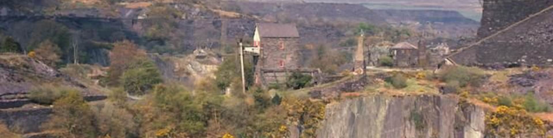 Dorothea pumping engine and Penyrorsedd Quarries. The view shows the apparently precarious situation of the engine house between two of the quarry pits. The Penyrorsedd workings can be seen away into the distance. As can be seen in 2106 nature is reclaiming this industrialised area and the view in this 1976 picture would be difficult to replicate today.