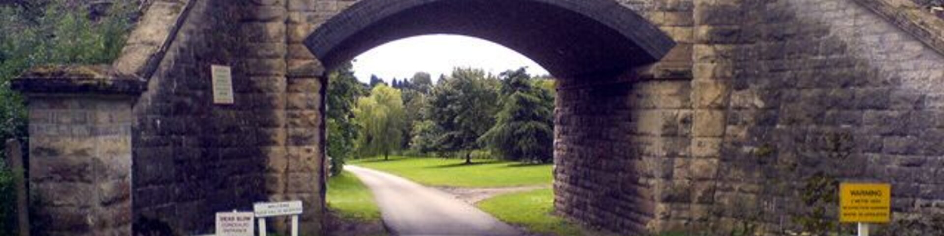 Railway Bridge near Gorsethorpe A railway bridge carrying the rail track over a road leading to Sherwood Forest Caravan Park.
