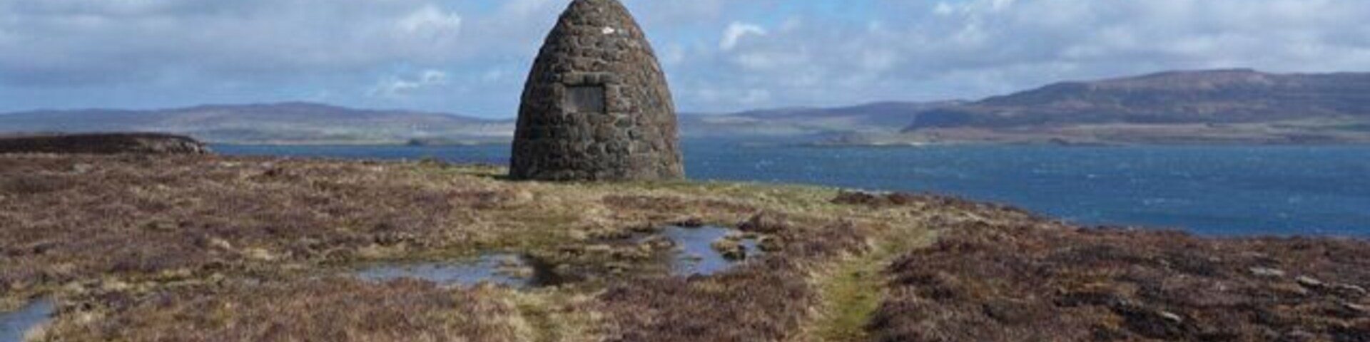 The MacCrimmon memorial cairn The cairn sits on Boreraig Hoe above Loch Dunvegan. The inscription on it is in Gaelic. It translates (to the best of my limited ability) as: "Remembrance cairn for the Clan MacCrimmon, hereditary pipers to the Macleods for ten generations and who were famous as writers, players and teachers of bagpipe music. Close to this place was the MacCrimmon music school from 1500 to 1800 AD."