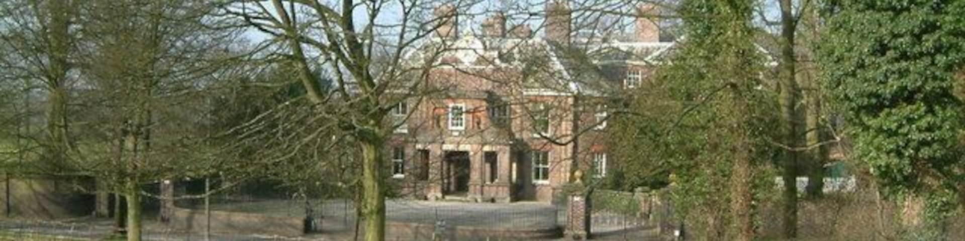 Betley Court Betley Court through the trees