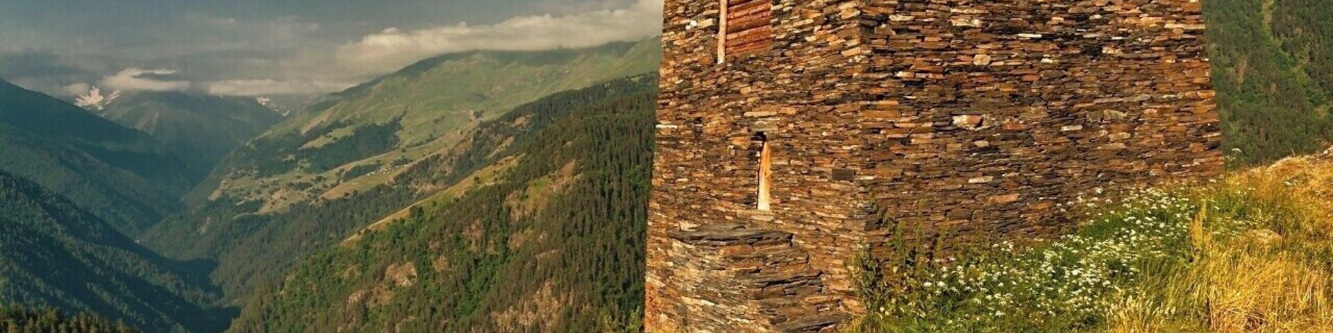 July 2010 
Keselo Fortress, Kvemo Omalo, Tusheti 
One of the towers of Keselo,  a medieval fortress consisting of 13 towers built in 14-15th century, altitude is ca. 2.000 metres. The fortress originally served as protection against Mongol invaders and later against Dagestani invaders. It was mostly used only in summer months when the raids were usual. In winter people lived in the village below the fortress. It has lost its purpose in 19th century after the Russians allied with local Tushs. It was abandoned and destroyed during World War II. In 2003 the reconstruction started and sponsored by a Dutch family. Many of the towers were built back from ruins, accomodating a museum of local tradition with many old photos from the region. Keselo is few tens of metres over the village Kvemo (=Upper) Omalo, which is a usual starting point for trek west to Shatili in Khevsureti region or day hikes to Shenako or Diklo villages to the east.