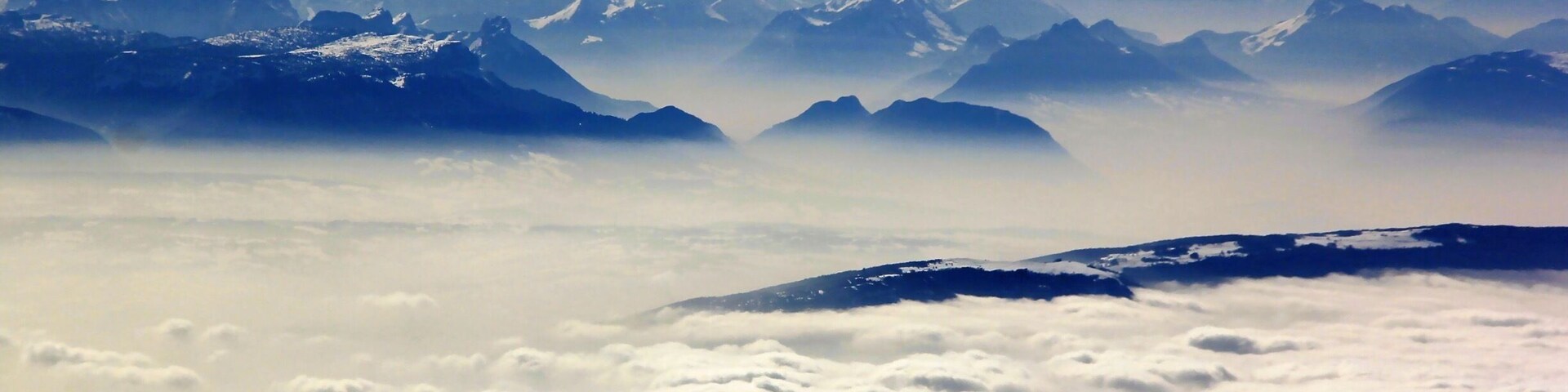 When my flight flying above the the mountains peaks and clouds, I can see the mountains peaks peeping out of the fogging and swirling mist with the white clouds floating around the mountains it look heavenly. #mountains #France #nationalpark #travel #snow #hiking #clouds #mountainscape #nature