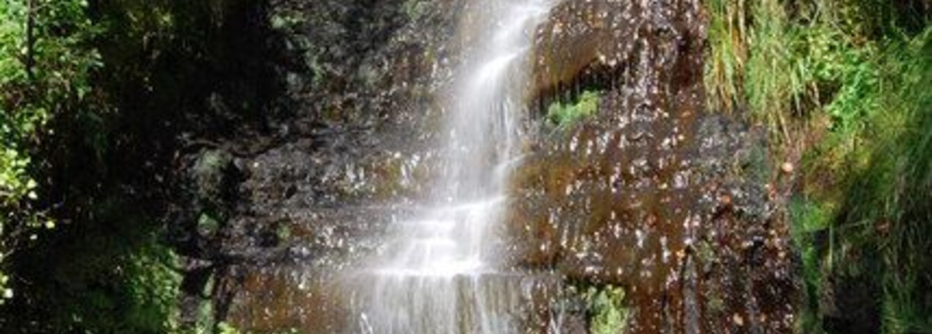 Waterfall on Twrch tributary stream Photograph taken 26/08/07. Late afternoon sun produced this lovely rainbow and highlighted the peat stained plunge pool. Worth a visit.
