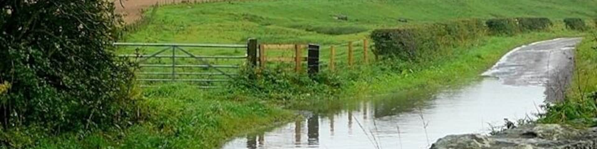 Flooded lane near Powburn This minor road crosses the Fawdon Burn on this bridge, and also crosses from Alnwick District to Berwick-upon-Tweed District. The flooding seems to be due to run off from the fields meeting a low point on the lane, rather than the burn being high.