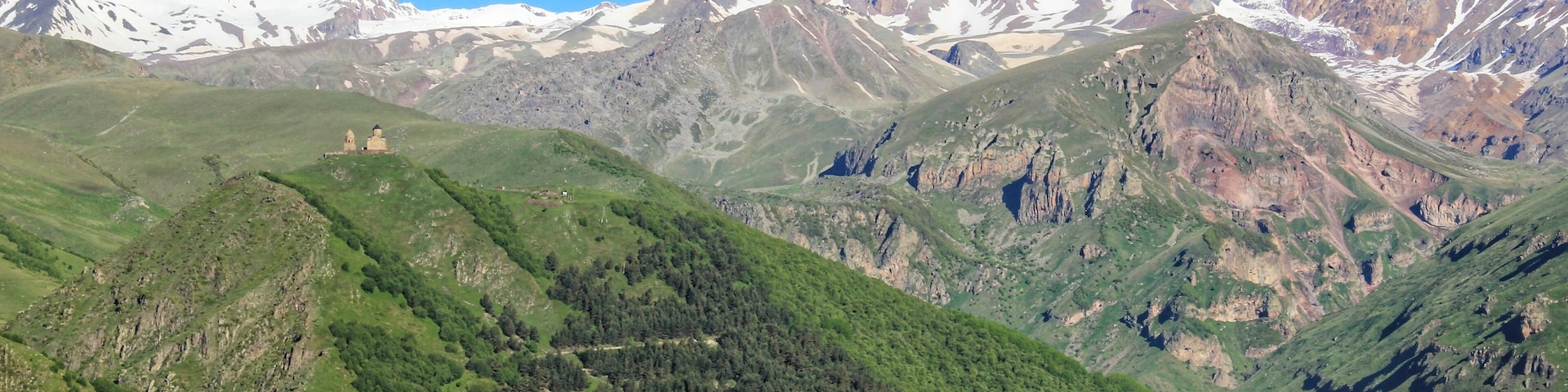 The majestic Mount Kazbek, standing at 5033 metres above sea level.
When we arrived into Kazbegi the mountain was all in shade and there was a lot of cloud around.
However when we awoke the next morning, this was our view from the balcony of our room at Rooms Hotel Kazbegi.
To read more about the places I visited on my 10-day Georgia itinerary by public transport, click on the following link.
https://galloparoundtheglobe.com/a-10-day-georgia-itinerary-by-public-transport/
