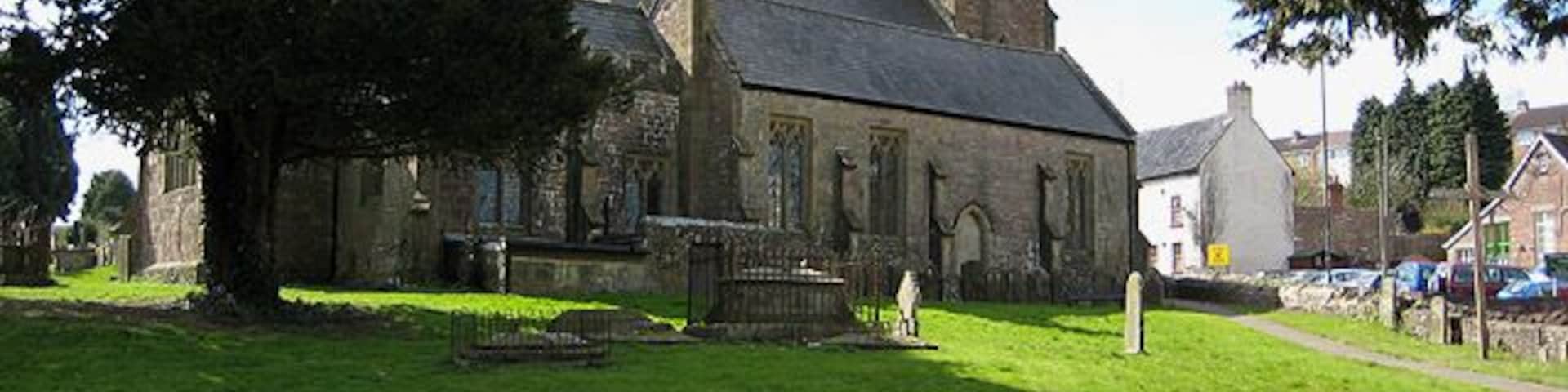 Church of St. Ethelbert, Littledean This once had a spire, but following a gale, it became unsafe and was removed in 1894. The clock on the tower is peculiar in that it bears no number 11. Roman numerals were used and IX appears twice instead of IX and XI. To the right of the picture, Littledean CE Primary School can just be seen.