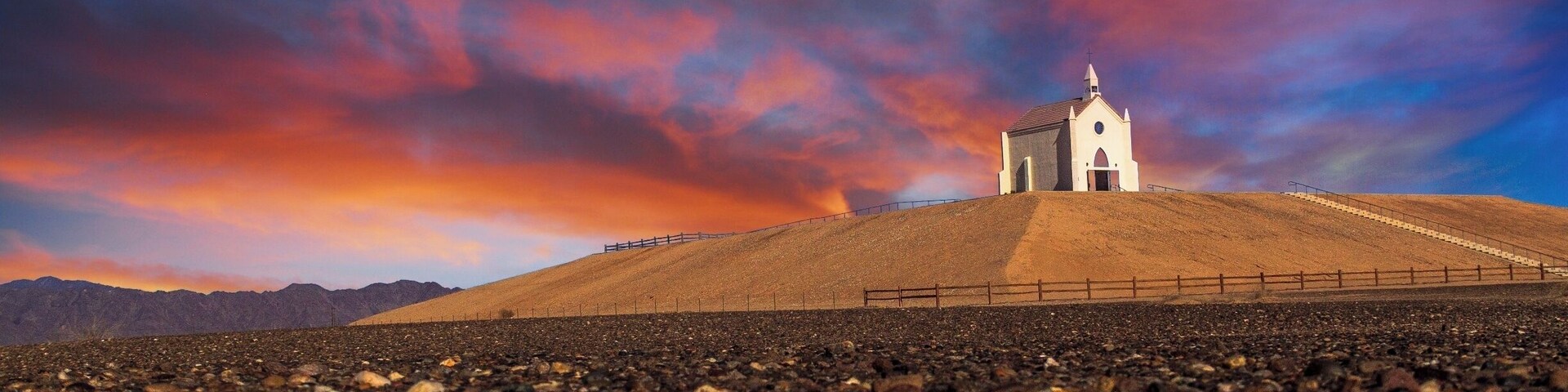 Istel is the founder of Felicity and the town’s longtime mayor, having been elected, almost 30 years ago, to an apparent lifetime term. The vote was unanimous: Istel voted for himself and so did Felicity’s other resident, Istel’s wife, Felicia. The town, established in 1986, consists of the Istels’ home and a half-dozen other buildings that the couple built on 2,600 acres in the middle of the desert near Yuma, Ariz., just off Interstate 8. At the north end, up an imposing staircase, sits the Church on the Hill at Felicity — inspired by a little white chapel in Brittany — that Istel built in 2007. The church is gorgeous and serene and looks eerily out of place, though less out of place than the 21-foot-tall stone-and-glass pyramid on the opposite end of town. The pyramid is there to mark the exact center of the world.