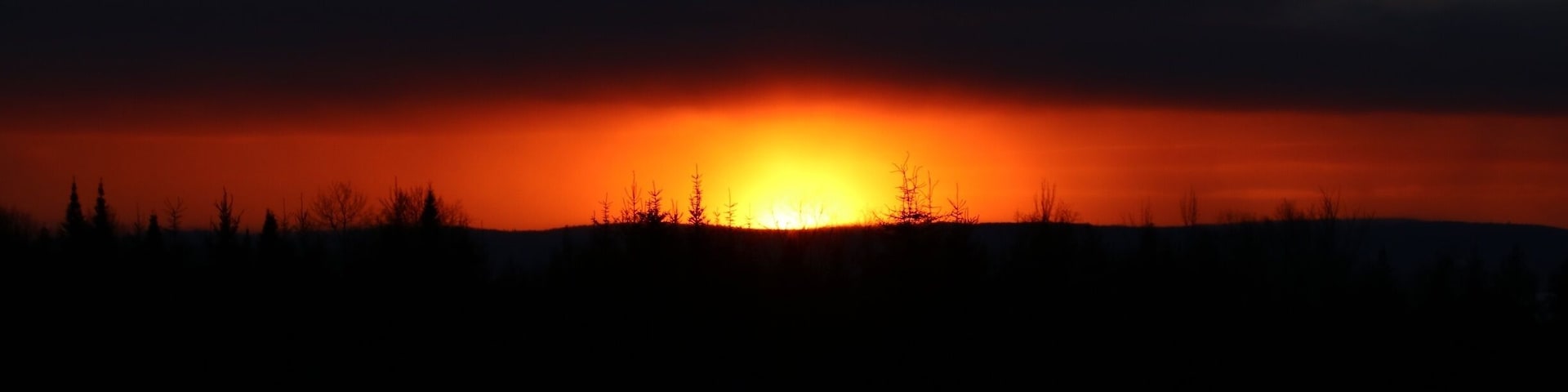Small hill on Aroostook Road (Route 11) overlooking a valley with awesome sunsets.