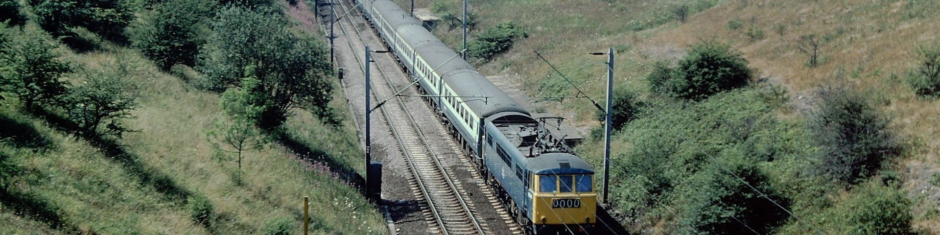 86-241 heads through the Church Lawford Cutting between Rugby and Coventry 29-07-1976