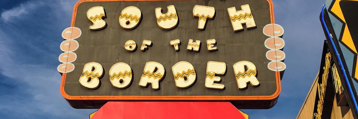 South of the Border is a huge tourist trap south of the North Carolina and South Carolina state borders on Interstate 95-no place near Mexico, but this Mexican-style rest stop has been attracting people since the 1950's. Billboards advertising this famous truck/rest stop can be seen several states away, each sign with a catchy saying to make you smile and to count the miles till you can hang out with Pedro, the mascot of South of the Border.
There are several restaurants, gas stations and plenty of shopping for knick-knacks and fireworks. There is a hotel/motel and a campground-all have use of the huge indoor pool, as well as an outdoor pool. And if that wasn't enough to do, there is also mini-golf and a reptile exhibit. The building are sprawled over several blocks, each one painted bright colors and lit well by neon lights at night.