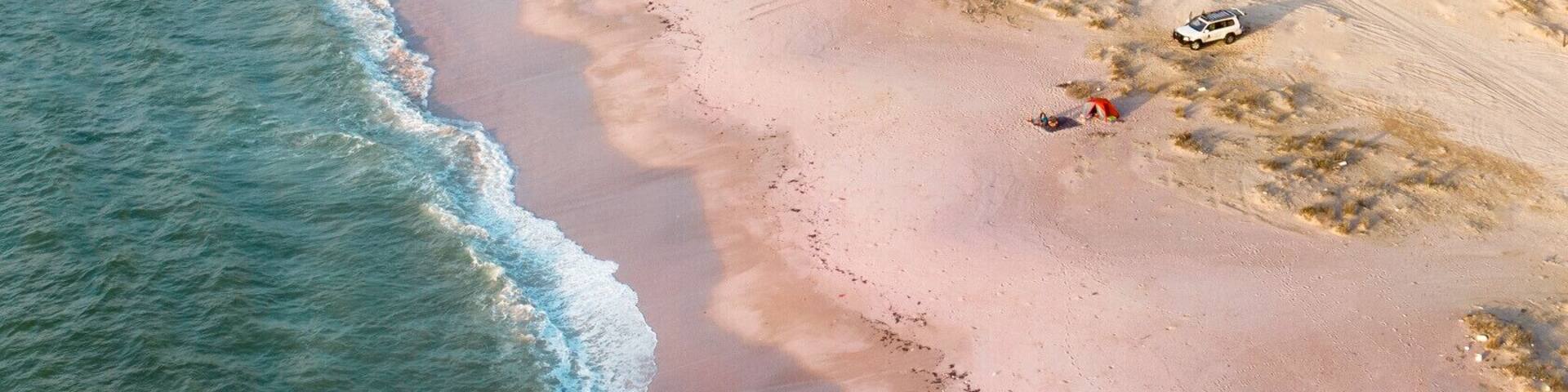 We found this pink beach on a road trip across Oman. This country has been an incredible journey into a world undiscovered by tourism. It is the best road trip country I’ve been to. #hiddengems #oman #pinkbeach