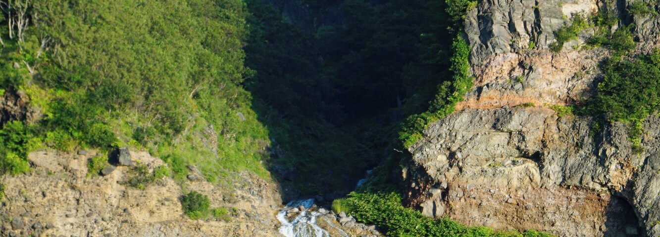 Kamuiwakka Falls and Mount Iō (Shiretoko) in Shari, Hokkaido prefecture, Japan.