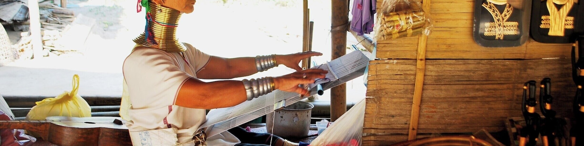 A woman from the Karen Long Neck Tribe.
In our day tour to Chiang Rai (the White Temple), we managed to squeezed in a quick trip to a village where a Karen tribe resides. The Karen tribe are infamous for their long necks, resulting from a lifetime of wearing brass coil neck rings (that increase in quantity as they age). Not all women from this tribe wear the neck rings however, just a small subset of the tribe called the "Padaung" and there are different accounts as to why they wear these rings. Whatever the origin of the custom, one of the reasons why this tradition continues today is due to tourism. People from all over the world, intrigued by their custom, travel to one of the furthest cities in the north of Thailand just to see them (me included). I wished that I could stay longer and talk to the villagers but due to the tight schedule of the tour, we only managed to take photos of the villagers and buy some souvenirs.
#karenvillage #karen #thailand #southeastasia #asia #travel #wanderlust #culture #people