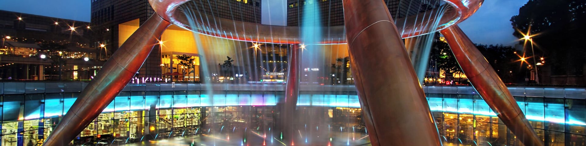 財富之泉 l The Fountain of Wealth *Corners of Singapore*
#Trovember Photo Contest
#Suntec City
#Singapore
#City
#Cityscape
#Landscape
#Night
#Cloud
#Cloudscape
#Sky
The Fountain of Wealth is listed by the Guinness Book of Records in 1998 as the largest fountain in the world. It is located in one of Singapore's largest shopping malls, Suntec City. During certain periods of the day, the fountain is turned off and visitors are invited to walk around a mini fountain at the center of the fountain's base to collect coins for good luck. At night, the fountain is the setting for laser performances, as well as live song and laser message dedications between 8pm to 9pm daily. It is situated in such a way the fountain is the hub of the shopping mall.  
This photo is inside my Top 30 "Corners of Singapore" collection album, enjoy all^^
Our Home by Kit Chan ~ Enjoy! 
https://www.youtube.com/watch?v=O7g-PUjbusQ";
Photo Licensed by iLOVEnature's Photography Inspiration l All rights reserved.
