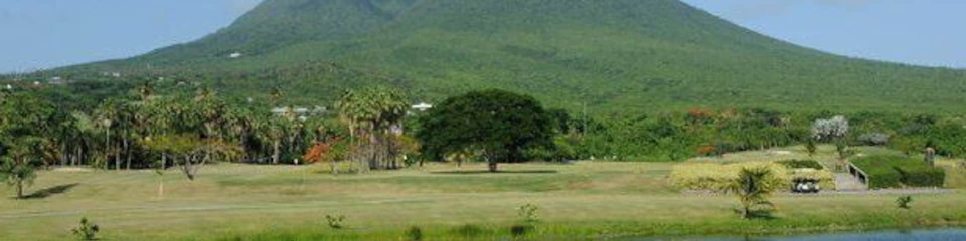 Nevis is the quintessential volcanic island paradise with its conical shaped peak that is normally obscured by cloud cover.
This was actually the view from our room and we had a rare clear day and the top was visible for a few hours.
The volcano was actually named by Christopher Columbus when he discovered the island in 1493. Thinking the white stuff on top of the volcano was snow he called it Nuestra Señora de Nieves. Nieve means snow in Spanish... it later morphed from Nieves to Nevis.
A very quite sleepy island that is great if you want to escape it all big time. It is truly one of the nicest islands in the Caribbean.