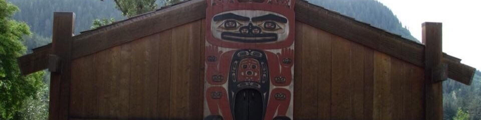 Tlingit Ceremonial House in Wrangell Alaska.
If you go around the back there is a long open shed with 3 very large totem poles lying down that used to stand here but are in need of restoration.