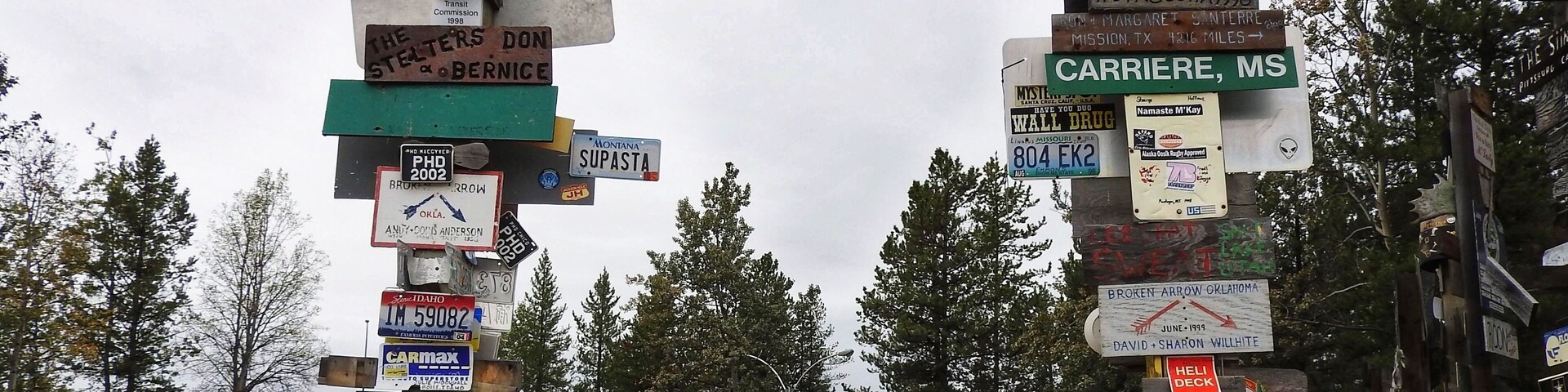Sign Post Forest is a collection of signs at Watson Lake, Yukon Territories, and is one of the most famous of the landmarks along the Alaska Highway. It was started by a homesick GI in 1942. He was assigned light duty while recovering from an injury and erected the signpost for his hometown: Danville, Ill. 2835 miles. Wikipedia (September 2016)