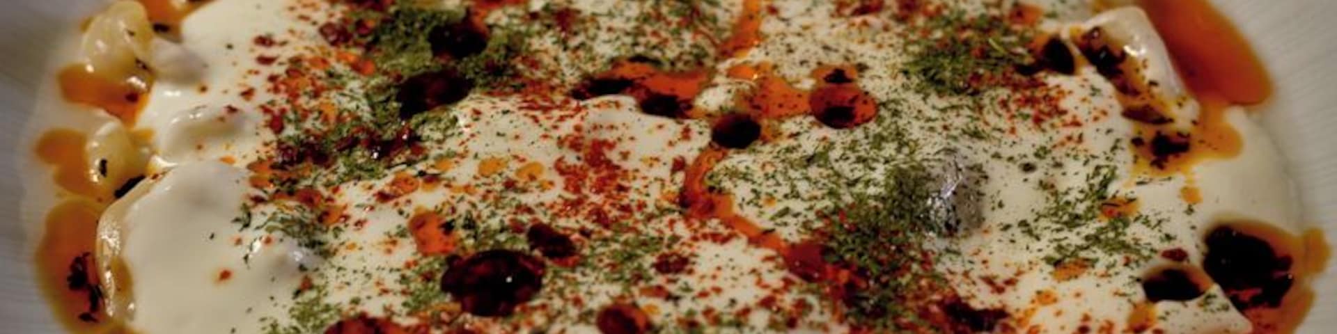 Turkish food is one of our favourites, and this dish of manti beats them all. A small ravioli type pasta (filled with spiced meat), covered in a yogurt sauce with chili oil and dill.
We enjoyed it in many places throughout Turkey, but it was in the small town of Burhaniye in the northwest where it was the very best.