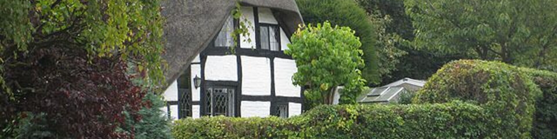 Timbered, thatched cottage, Southam 3 miles NE of Cheltenham, Southam is a mix of ancient and modern, with most of the houses built from a buff coloured stone. Dotted around is the occasional gem, such as this property near the Norman church.