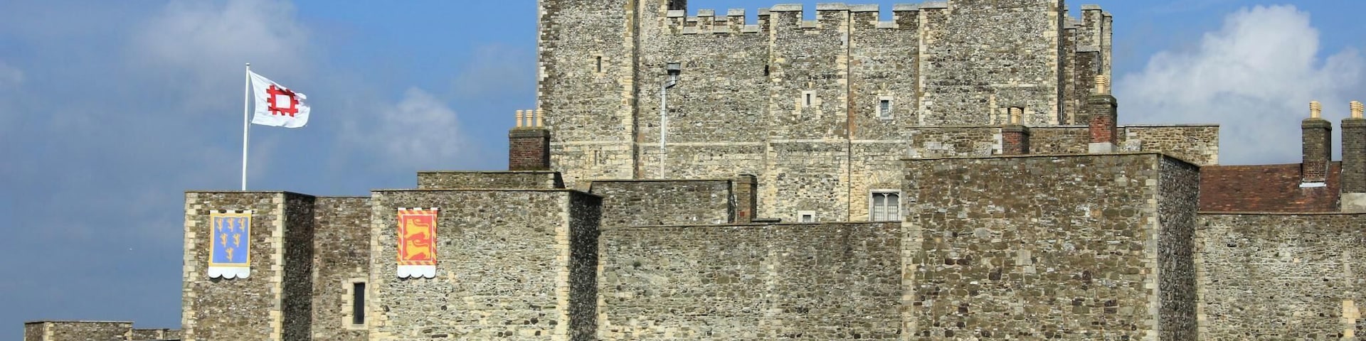For a great family day out in Kent visit Dover Castle, open all year round. Immerse yourself in our dramatic new visitor experience, Operation Dynamo: Rescue from Dunkirk, open now to visitors. Spectacularly situated above the White Cliffs of Dover this magnificent castle has guarded our shores from invasion for 20 centuries - now you can enjoy a great family day out with a visit to the 'Key to England'. Explore the darkly atmospheric Secret Wartime Tunnels now with a vivid recreation of the Dunkirk evacuation, complete with dramatic projections of swooping Spitfires and real film footage. Watch Heart FM's breakfast team James & Charlie as they experience Operation Dynamo. Enjoy a colourful contrast with the richly-furnished Great Tower, where costumed actors introduce medieval life at King Henry II's court. With exciting exhibitions, winding tunnels to explore, ghosts to hunt out - and of course restaurants, shops and the space for youngsters to run around - an action-packed, great value day out awaits!