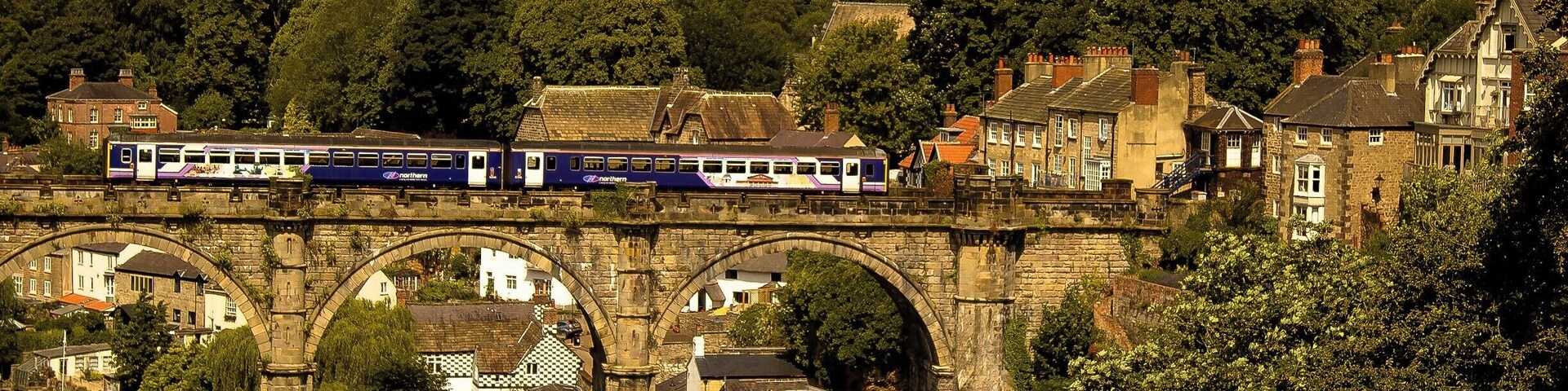 This shot is taken from Knaresborough Castle facing the river and the rail bridge. Knaresborough is located near Harrogate North Yorkshire.