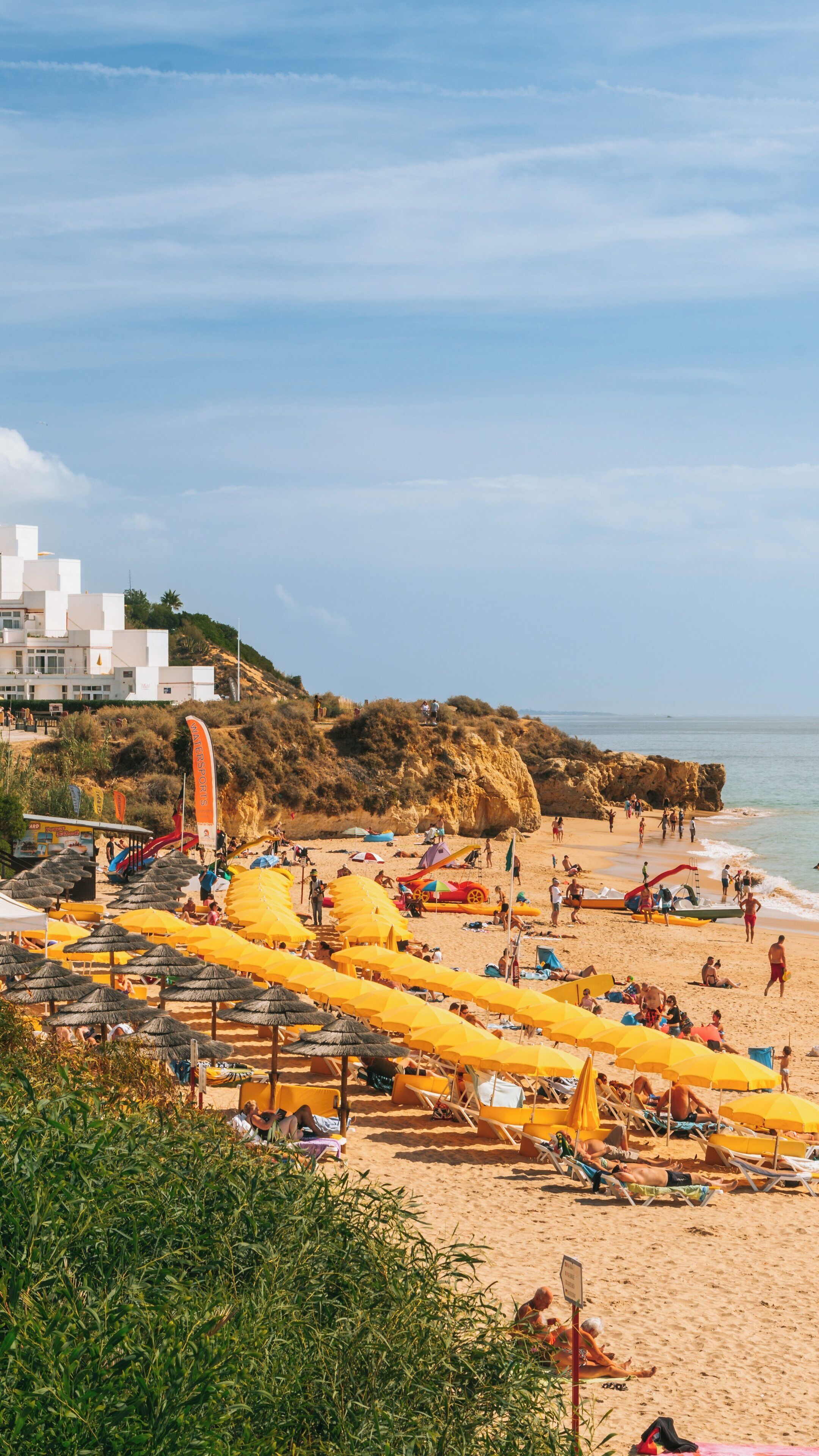 Relaxation and sunbathing at Oura Beach in Santa Eulália, Albufeira, Faro District, Portugal on a sunny afternoon