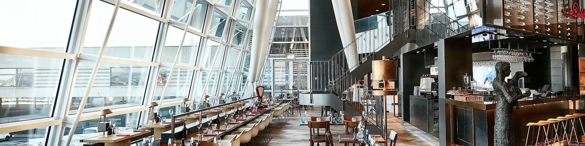 Zurich which includes interior views, a bar and an airport