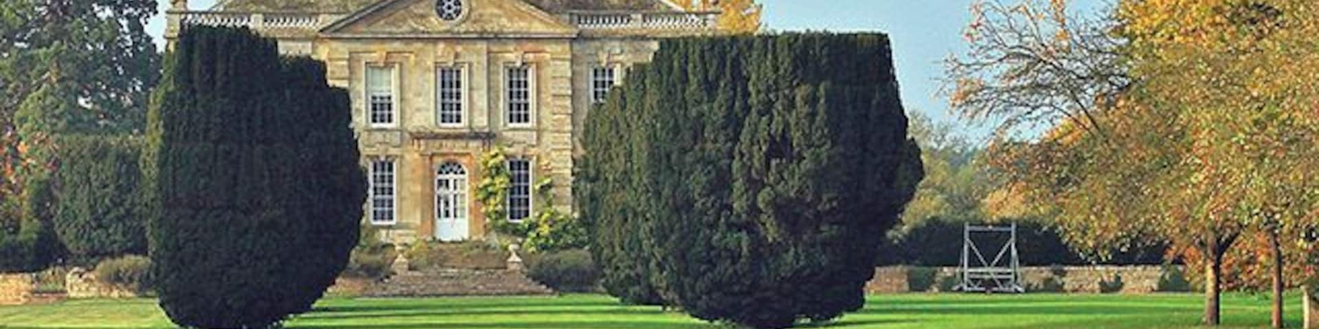 Bruern Abbey: pond and sculpture, near to Bruern Abbey, Oxfordshire, Great Britain. Heavily cropped to show details of the superb lily pond and sculpture
