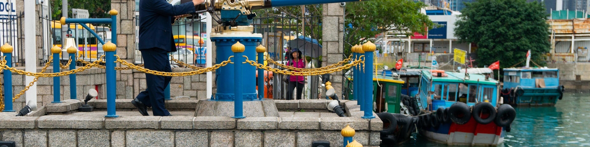 Noon Day Gun showing military items, a bay or harbor and heritage elements