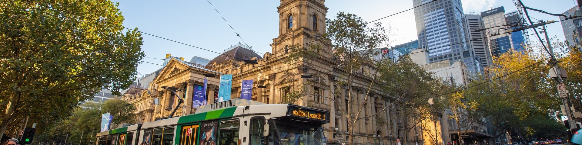 Melbourne Town Hall showing a city, railway items and heritage architecture