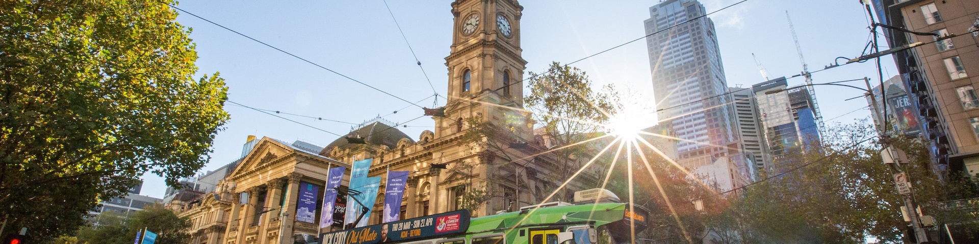 Melbourne Town Hall showing heritage architecture, a sunset and railway items