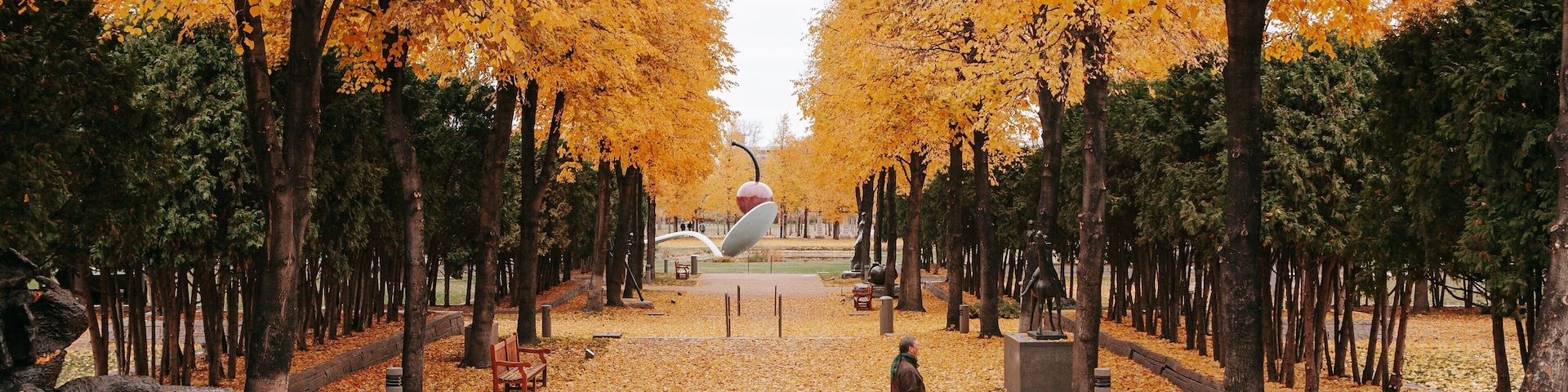 Walker Art Center featuring a garden and autumn leaves as well as an individual male