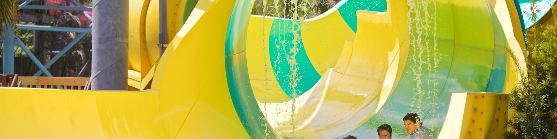 Adventure Island showing a waterpark as well as a small group of people