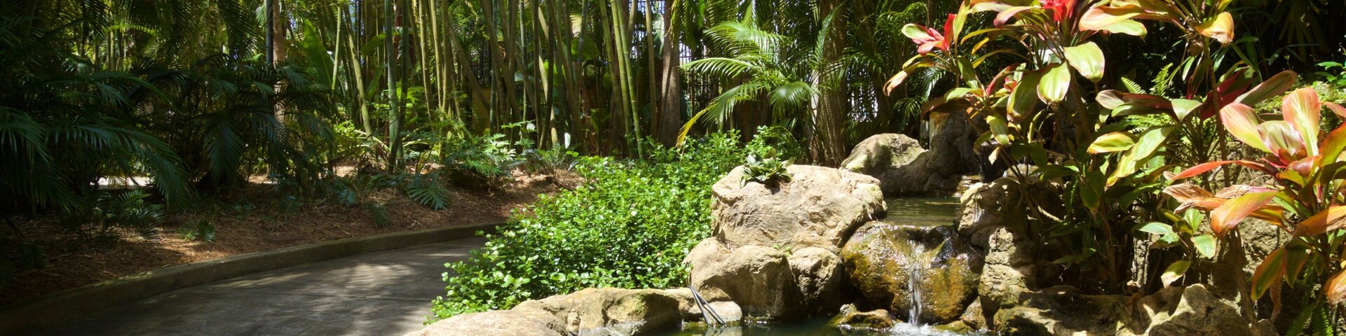 Sunken Gardens which includes a pond and a garden
