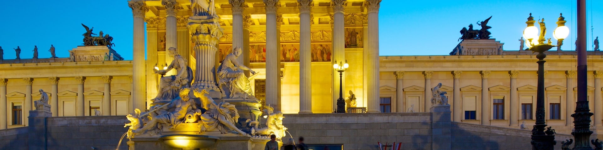 Prédio do Parlamento Austríaco que inclui uma cidade, cenas noturnas e um edifício administrativo