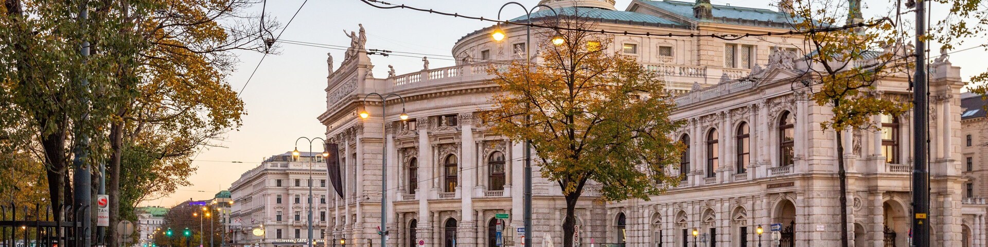 Burgtheater which includes a sunset and heritage architecture
