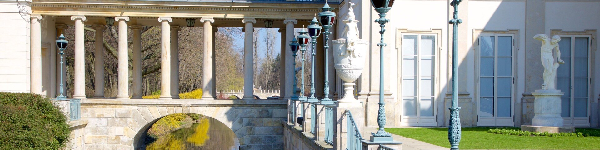 Lazienki Palace which includes chateau or palace and a river or creek