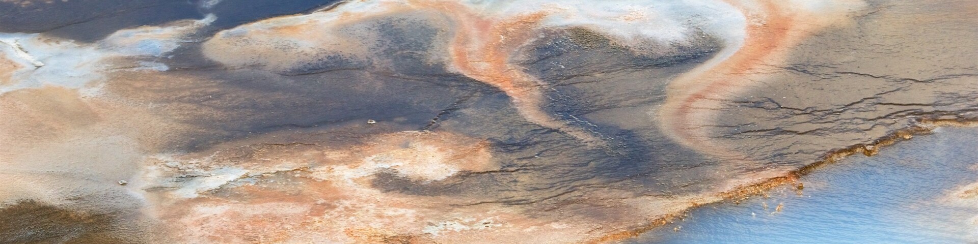 Norris Geyser Basin which includes a hot spring and landscape views