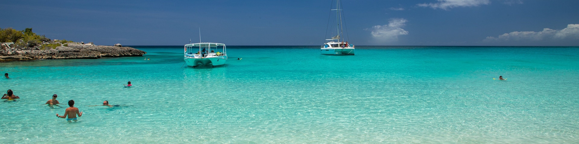 Mullet Bay Beach which includes tropical scenes, general coastal views and a beach