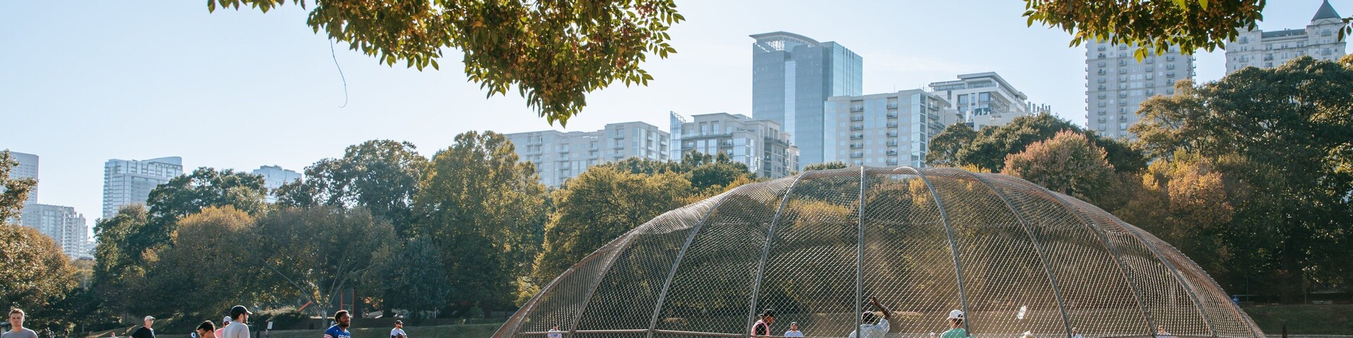 Piedmont Park as well as a small group of people