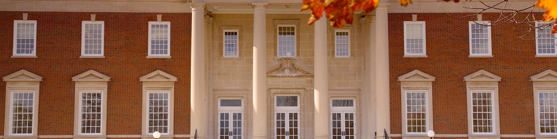 Autumn leaves frame historic building in Lincoln Park Chicago