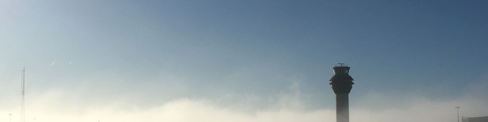 The fog came down so quickly a couple of days ago. Quite eerie to see this plane creeping past ATC tower in the very early morning sun/fog.