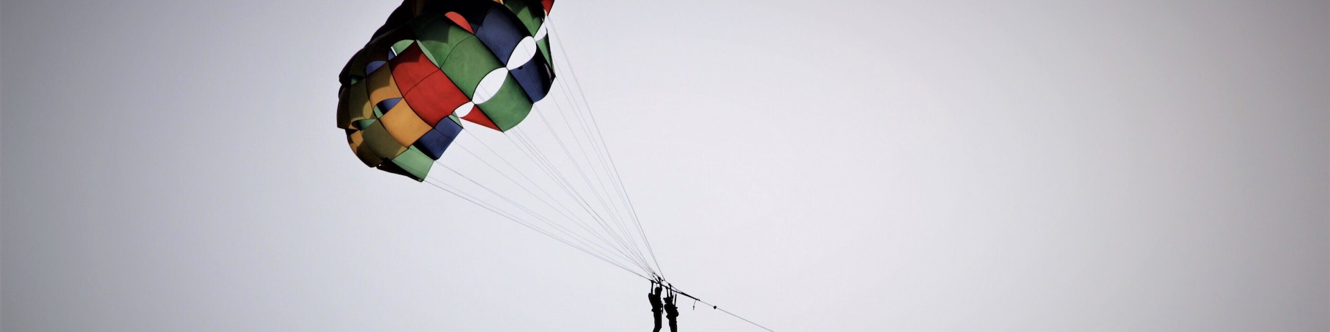 Parasailing silhouette at Miramar beach in Goa, India