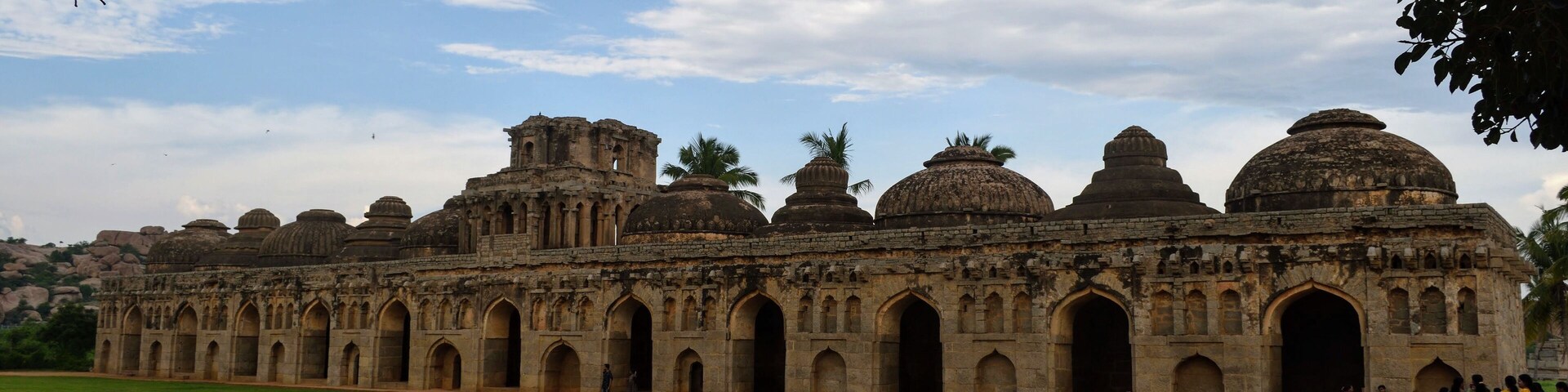 The long and imposing 11 domed stables built for the royal elephants are a part of the Zenana enclosure in Hampi. There are numerous beautiful carvings on each of the grand arches. There is a small secret (no longer) stairway in the central dome to climb to the roof but it's closed for visitors. This is also one of the few well preserved structures in Hampi.