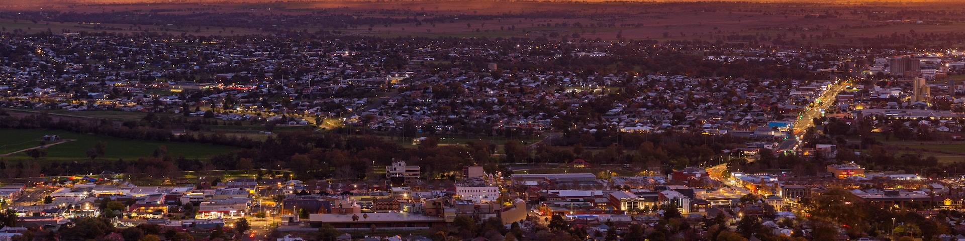 Oxley Scenic Lookout which includes landscape views, a city and a sunset