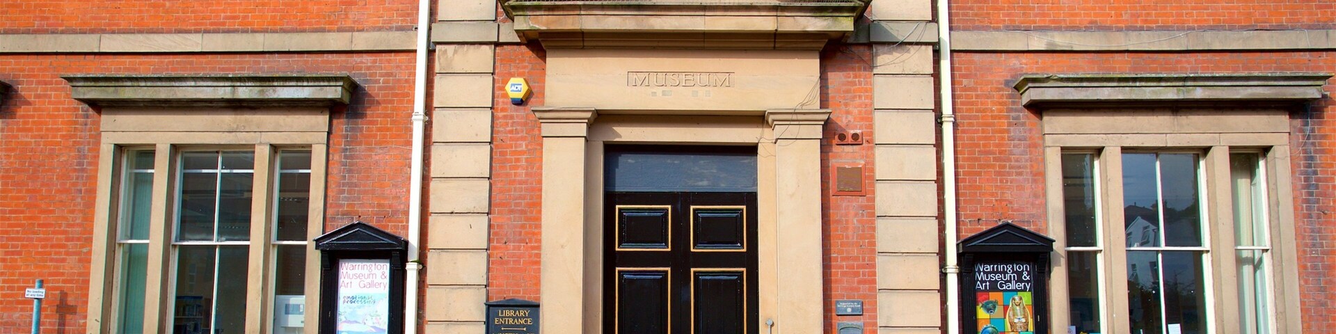 Warrington Museum & Art Gallery featuring street scenes and heritage elements as well as an individual femail