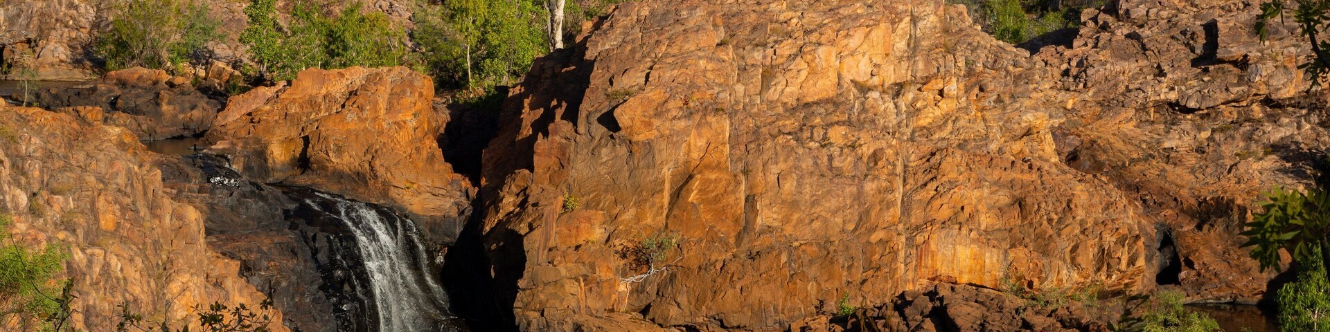 Edith Falls featuring a gorge or canyon, a river or creek and a waterfall