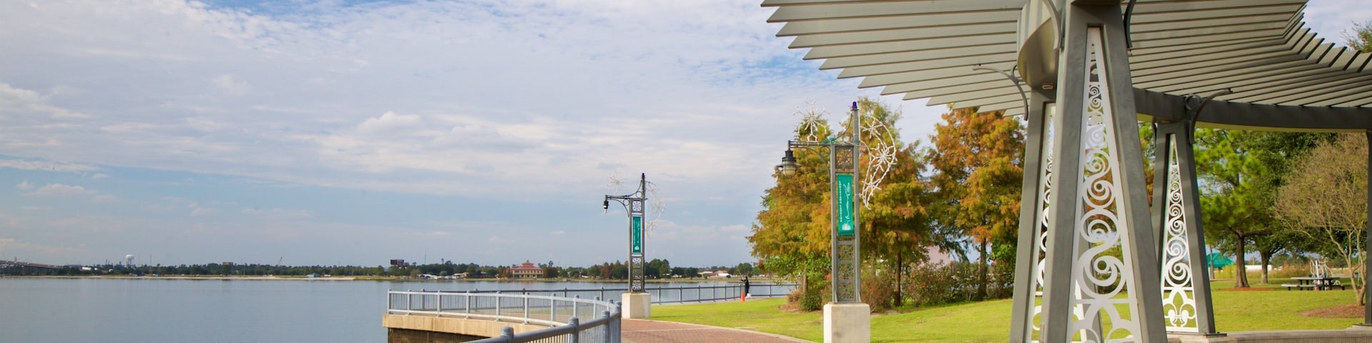 Bord Du Lac Park which includes general coastal views and a garden