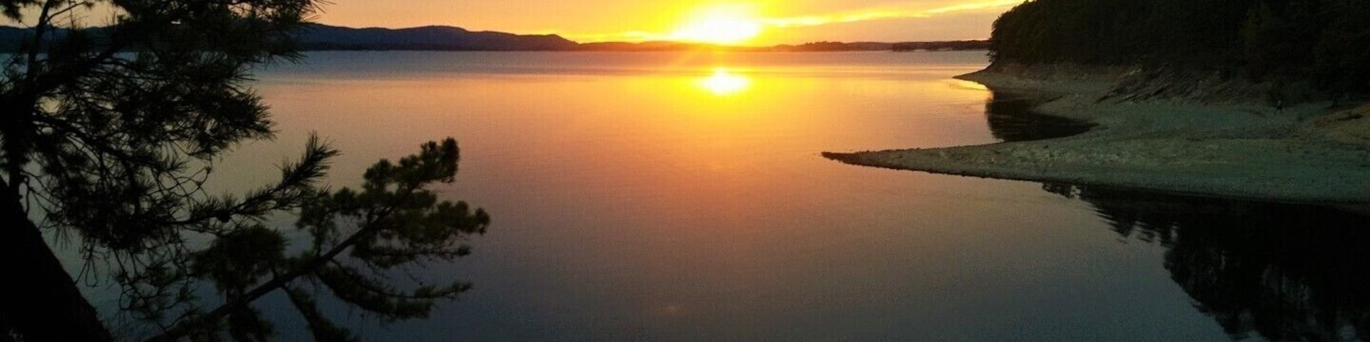 Camped out for the weekend on Hotel Island on Lake Ouachita (there is no hotel on the island :) It's just the largest of hundreds of islands on this lake). This was the view of our beach and first sunset on the lake. The water here was amazing and very clear as well, which made for great SCUBA diving conditions and the little bays around the islands provided calm water for wakeboarding and other watersports. #LifeAtExpedia #Nature #Trovember